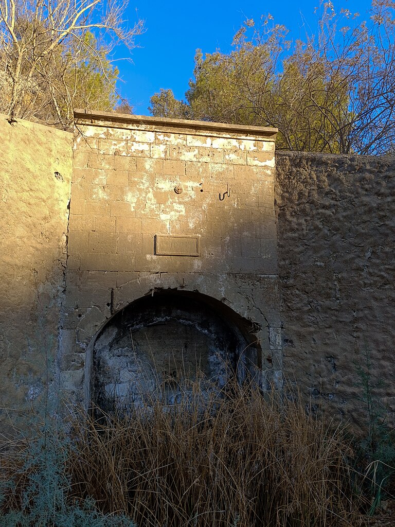 Old_CMC_mine_entrance_at_Gemikonağı-Karavostasi_dam_lake • Kültür Envanteri